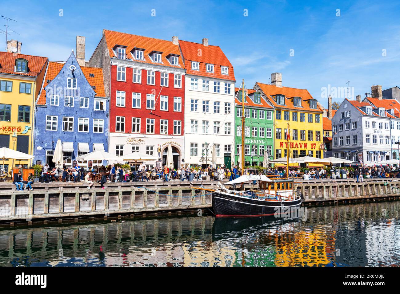 Nyhavn harbour with colourful houses reflected in the waters channel ...