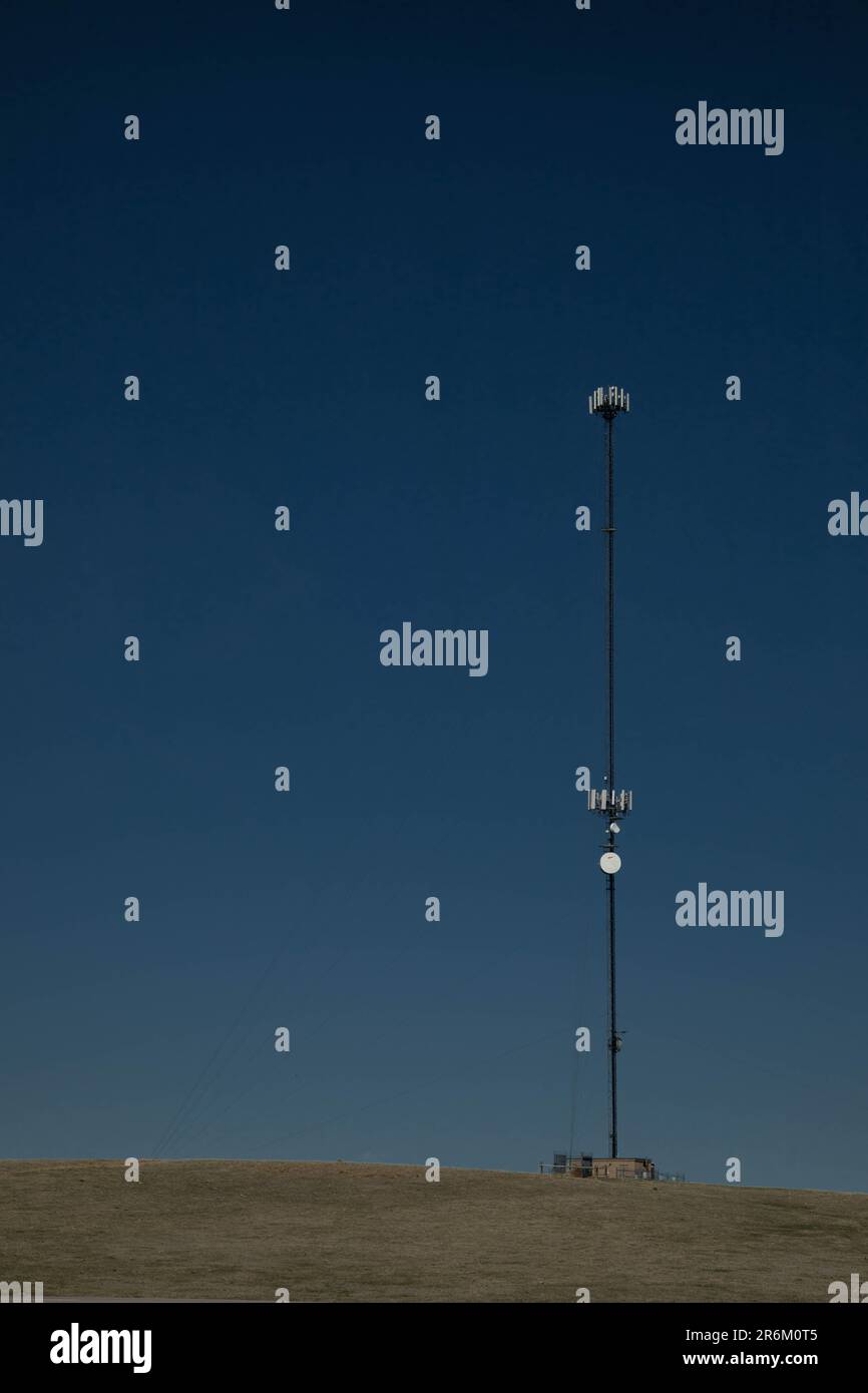 Cell tower against blue sky hi-res stock photography and images - Alamy