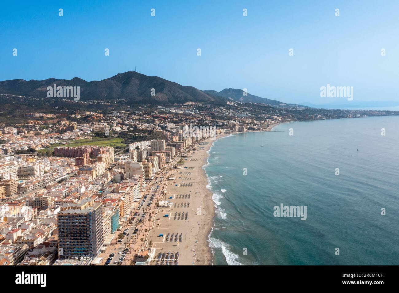 Aerial drone photo of the beautiful beach front of the coastal town of ...