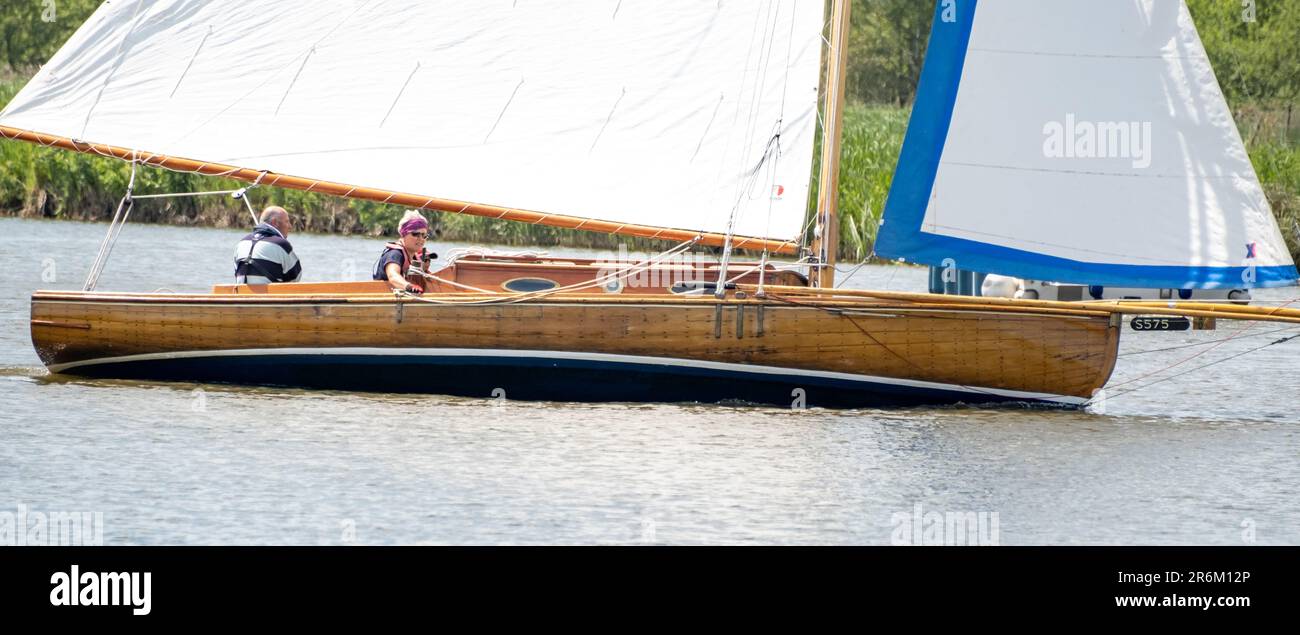 Side on view of a traditional wooden sailboat on the River Bure ...