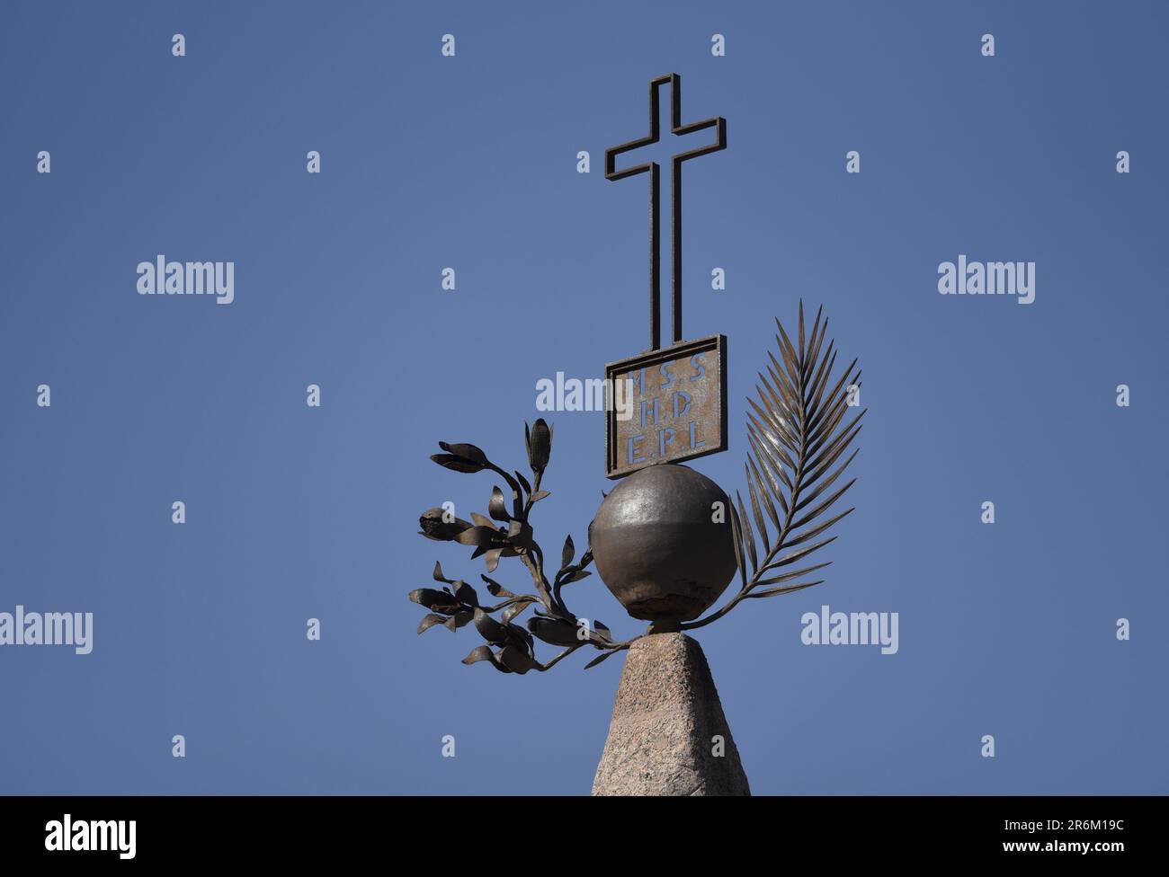 Antique bronze cross and religious symbol on the exterior of the ...