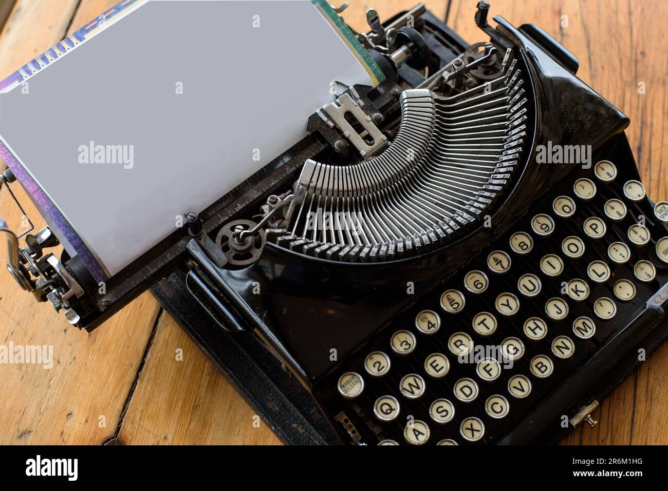a vintage typewriter with a clean sheet of paper ready to type a letter ...