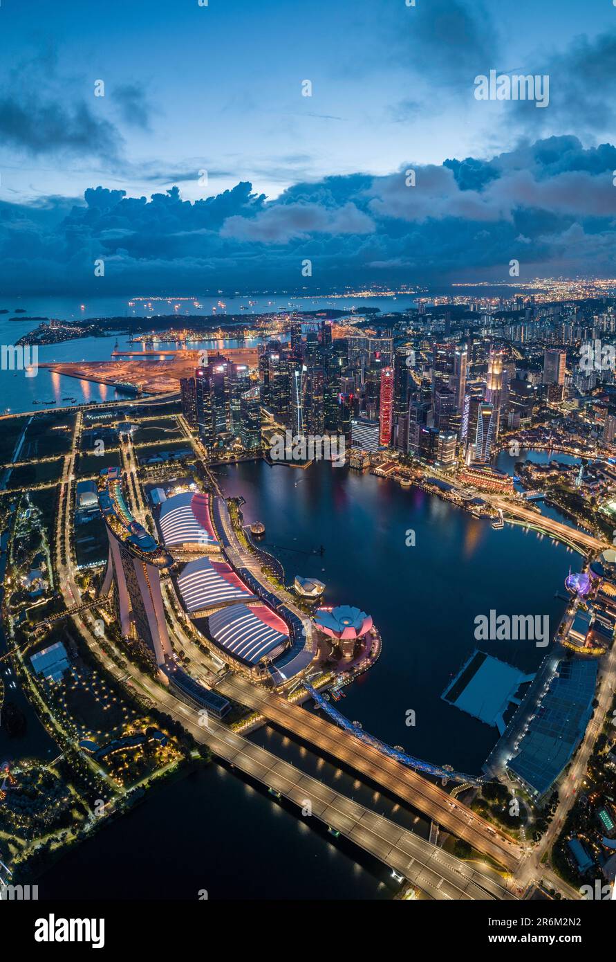Aerial view of Marina Bay Sands and Singapore City Harbour at night, Singapore, Southeast Asia ...