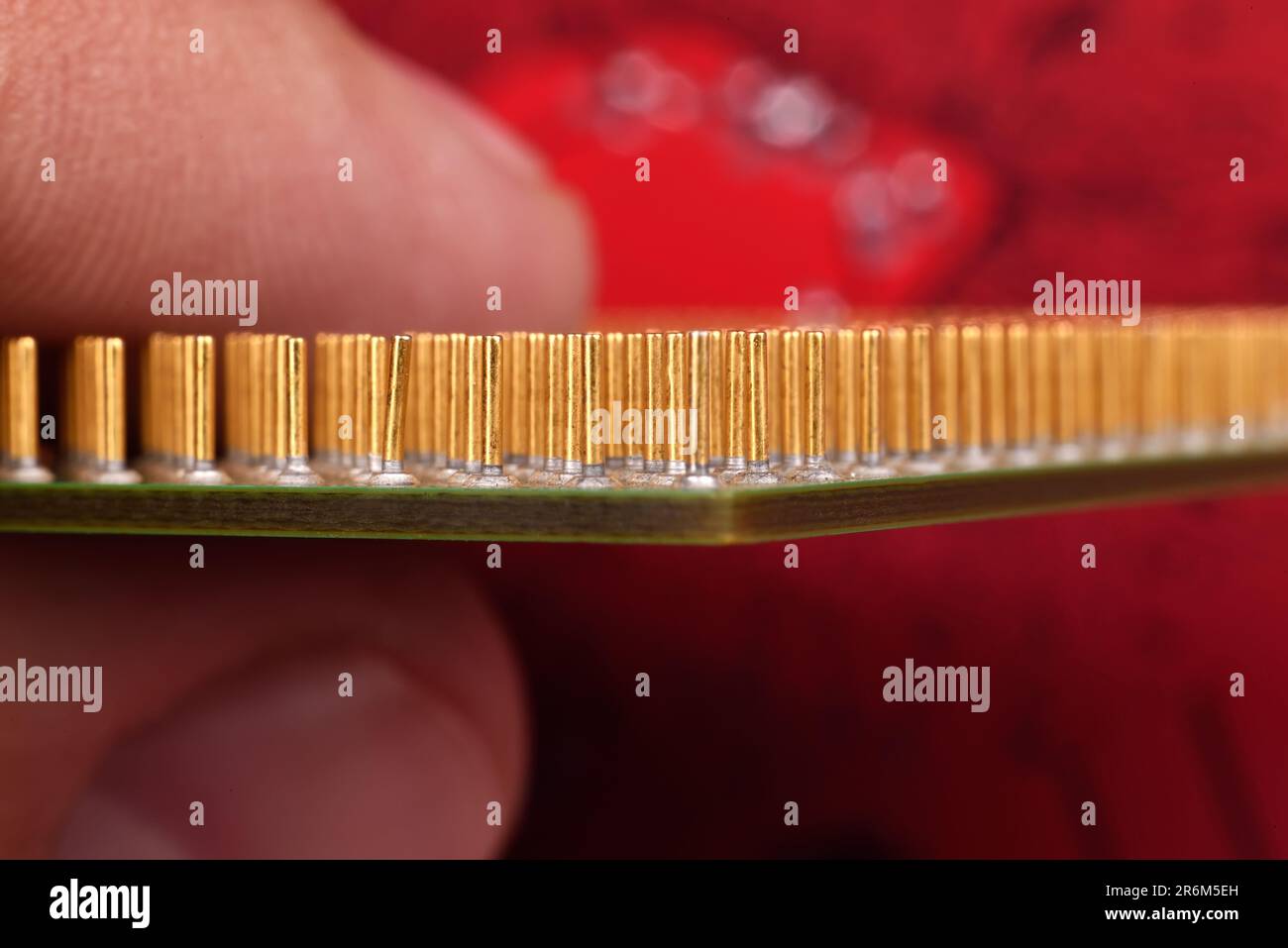 finger holding central processing unit, extra close up Stock Photo - Alamy