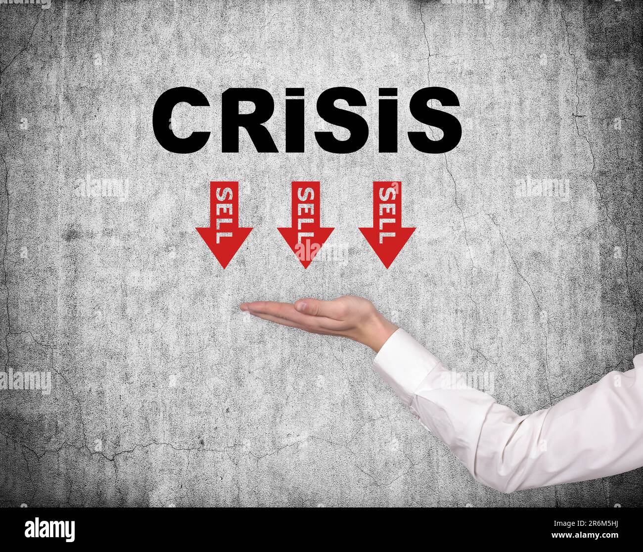 hand holding crisis symbol on gray wall background Stock Photo - Alamy