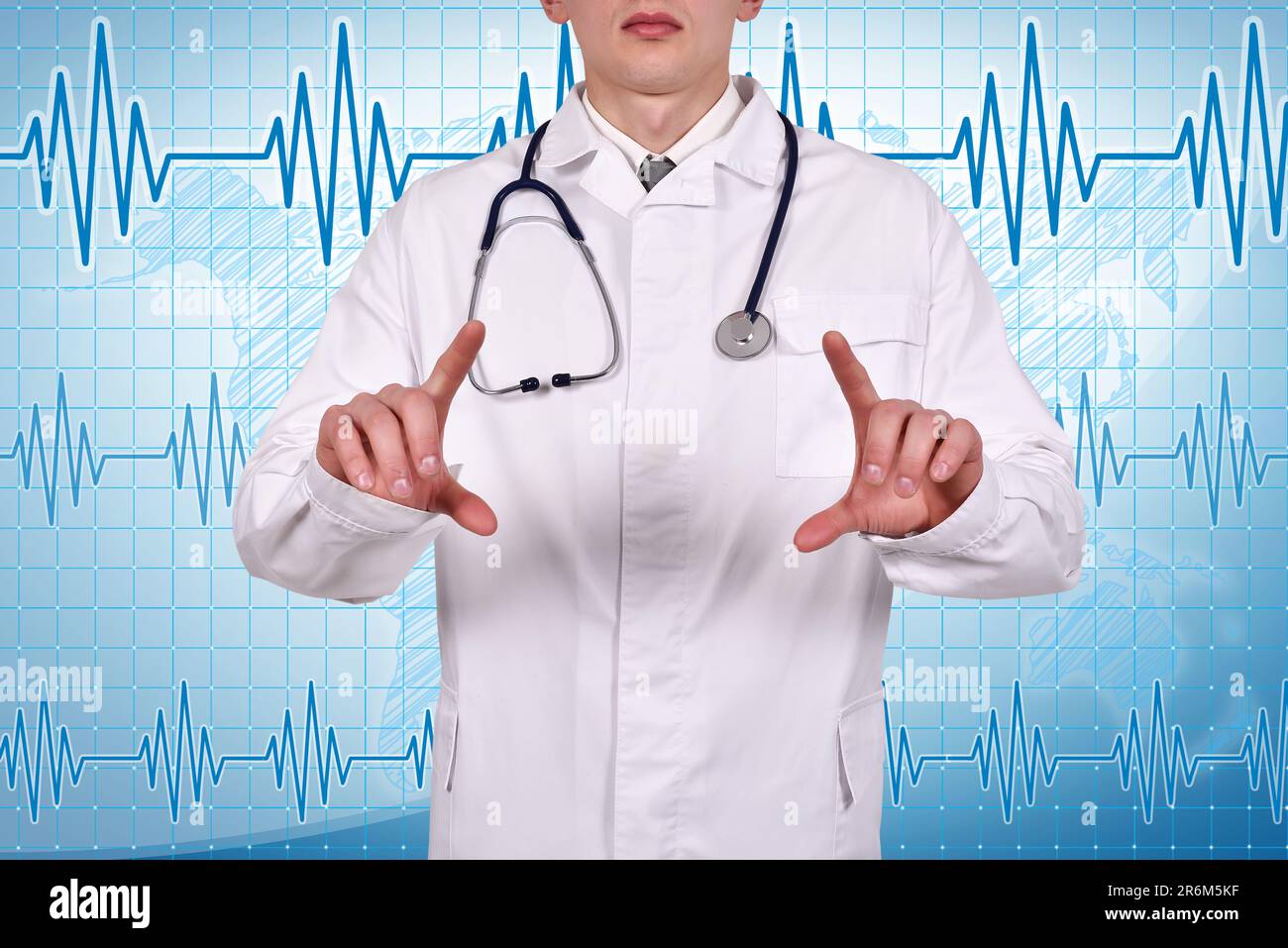 Young doctor with stethoscope holding invisible object Stock Photo - Alamy