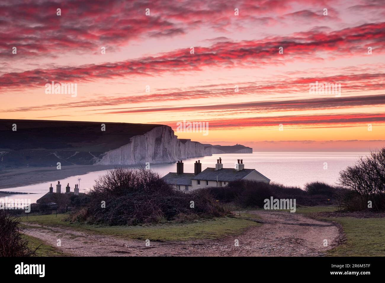 The Seven Sisters white chalk cliffs at dawn from Cuckmere Haven, South ...