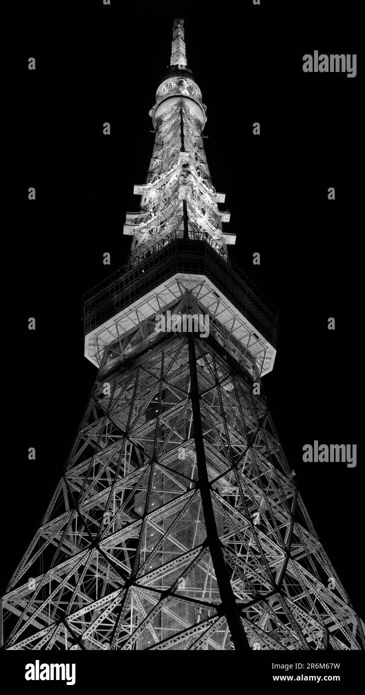 A low angle of the Tokyo Tower illuminated at night in Japan in grayscale Stock Photo - Alamy