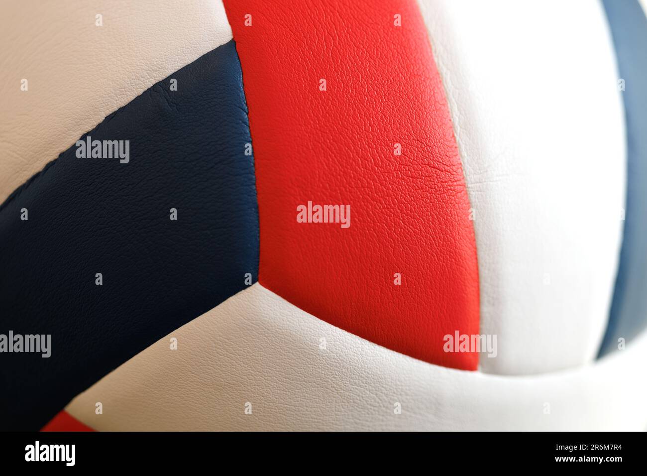 Close-up of the seams of a red dark blue white sports ball without a ...