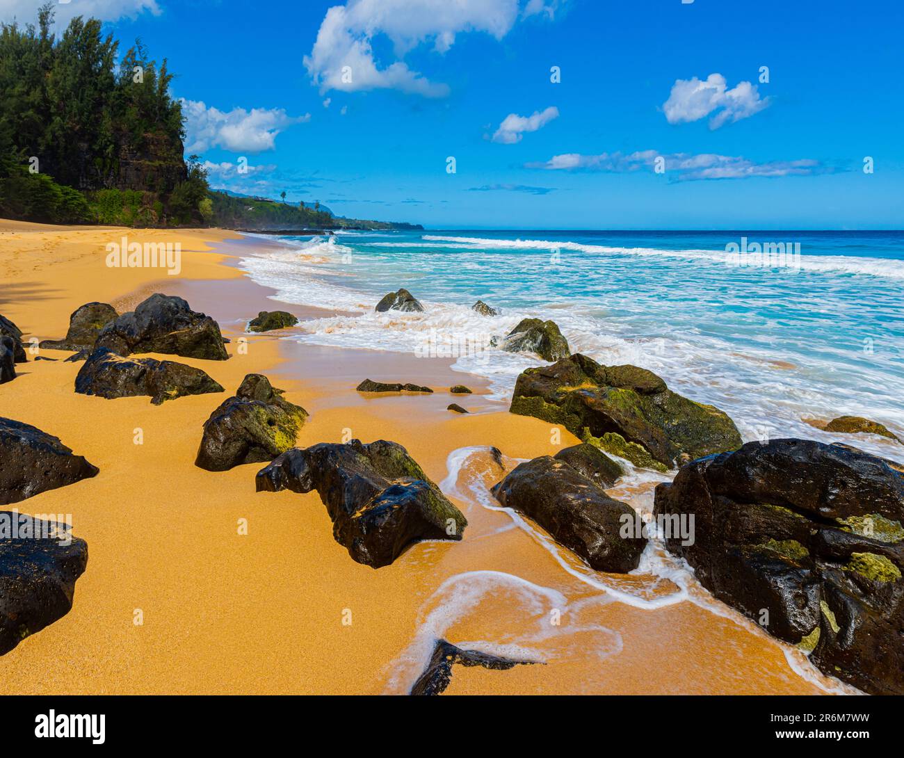 Lava Boulders On The Sandy Shore of Kauapea Beach, Kauai, Hawaii, USA ...