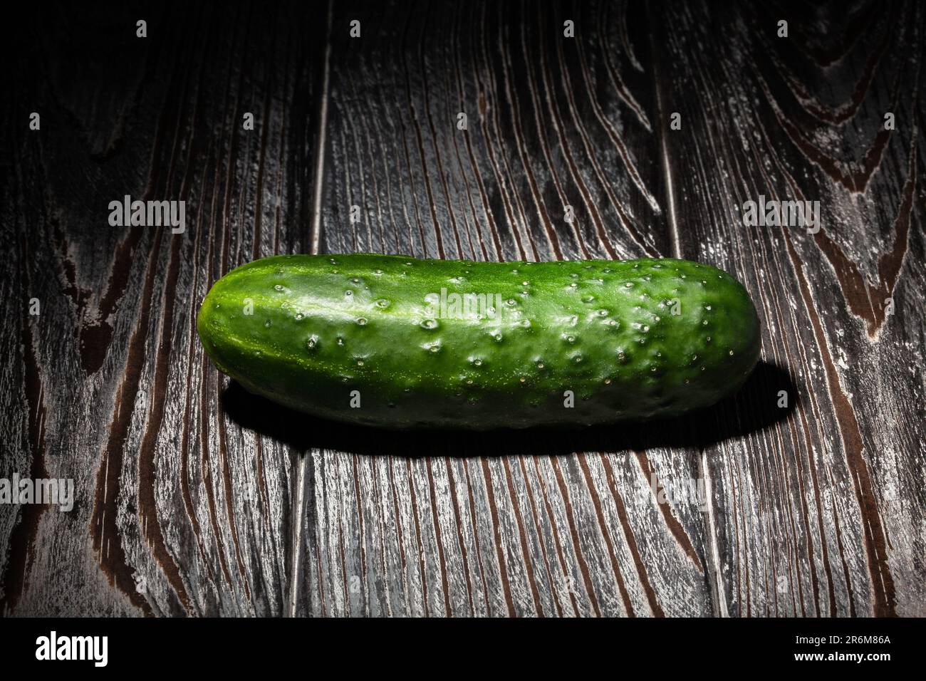 Green cucumber on black hi-res stock photography and images - Alamy