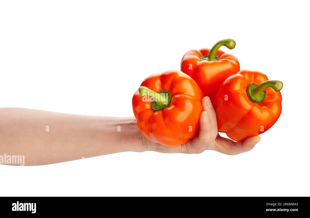 orange bell pepper in hand path isolated on white Stock Photo - Alamy