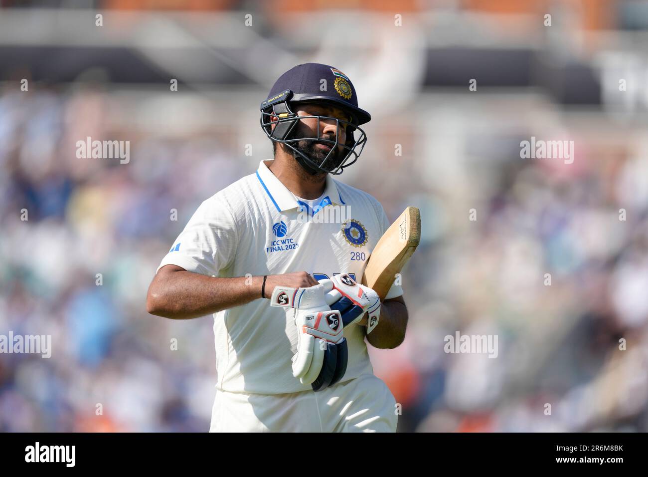 India's Rohit Sharma reacts after being given out lbw off the bowling of Australia's Nathan Lyon ...