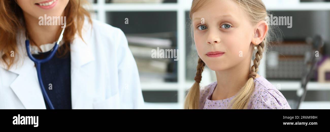 Friendly female pediatrician little girl health in clinic Stock Photo ...