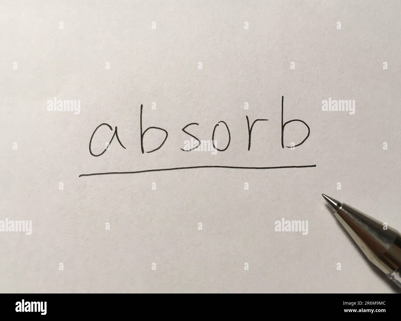 Absorb concept word on paper background Stock Photo - Alamy