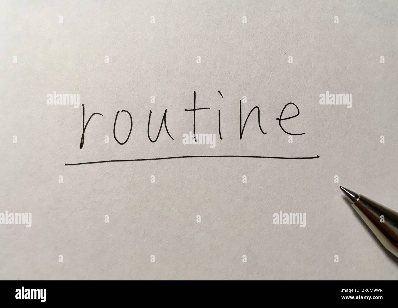 Routine concept word on paper background Stock Photo - Alamy