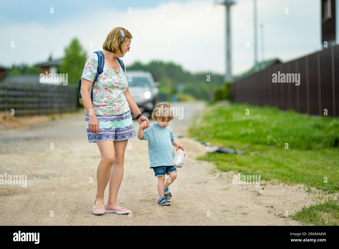 Grandmother with her toddler grandson having fun outdoors on beautiful ...