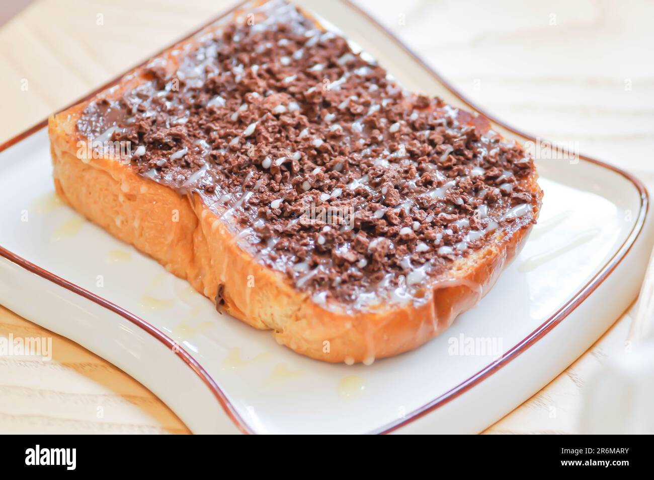 toast or bread with chocolate and condensed milk topping Stock Photo ...
