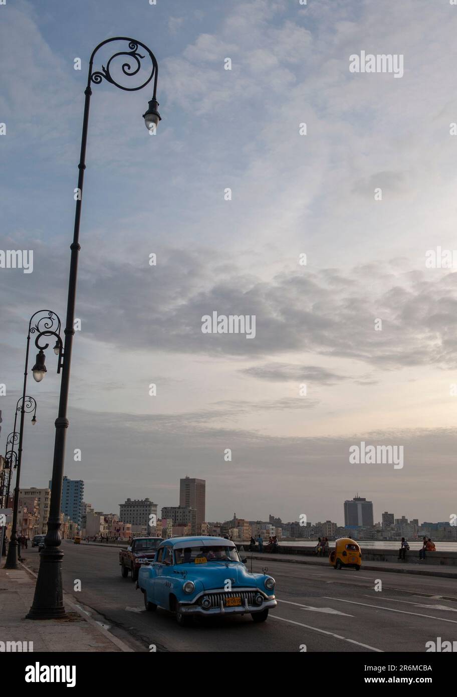 Havana, Cuba. Cars travel on the famous oceanfront on the Malecon Stock ...