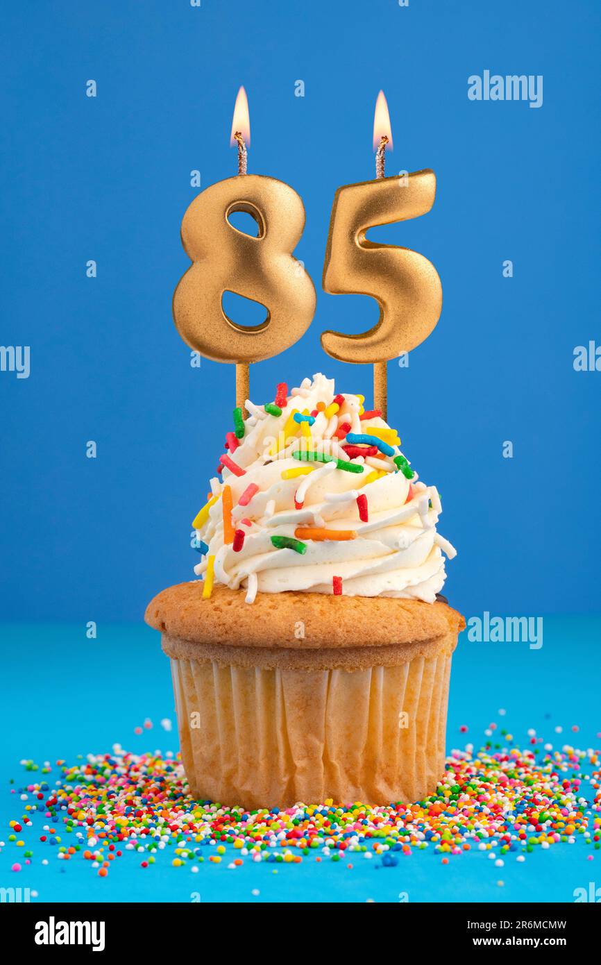 Candle number 85 - Cake birthday in blue background Stock Photo - Alamy