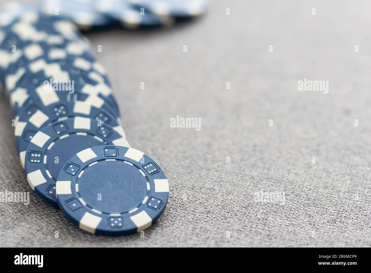 Blue poker chips on stock market chart background Stock Photo - Alamy