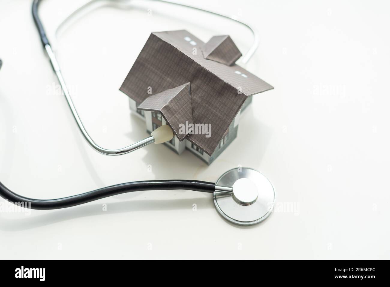 Miniature house and Medical stethoscope Stock Photo - Alamy