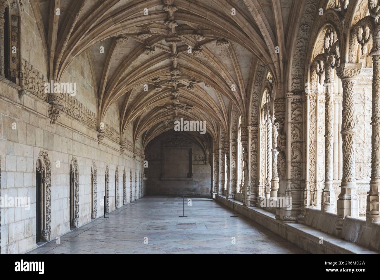 Corridor of the cloister in the Jeronimos Monastery with arched stone ...