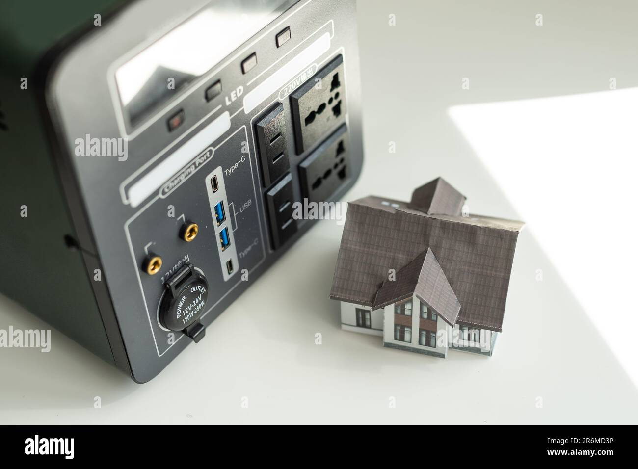Portable power station charging gadgets on table in room. Home Stock ...