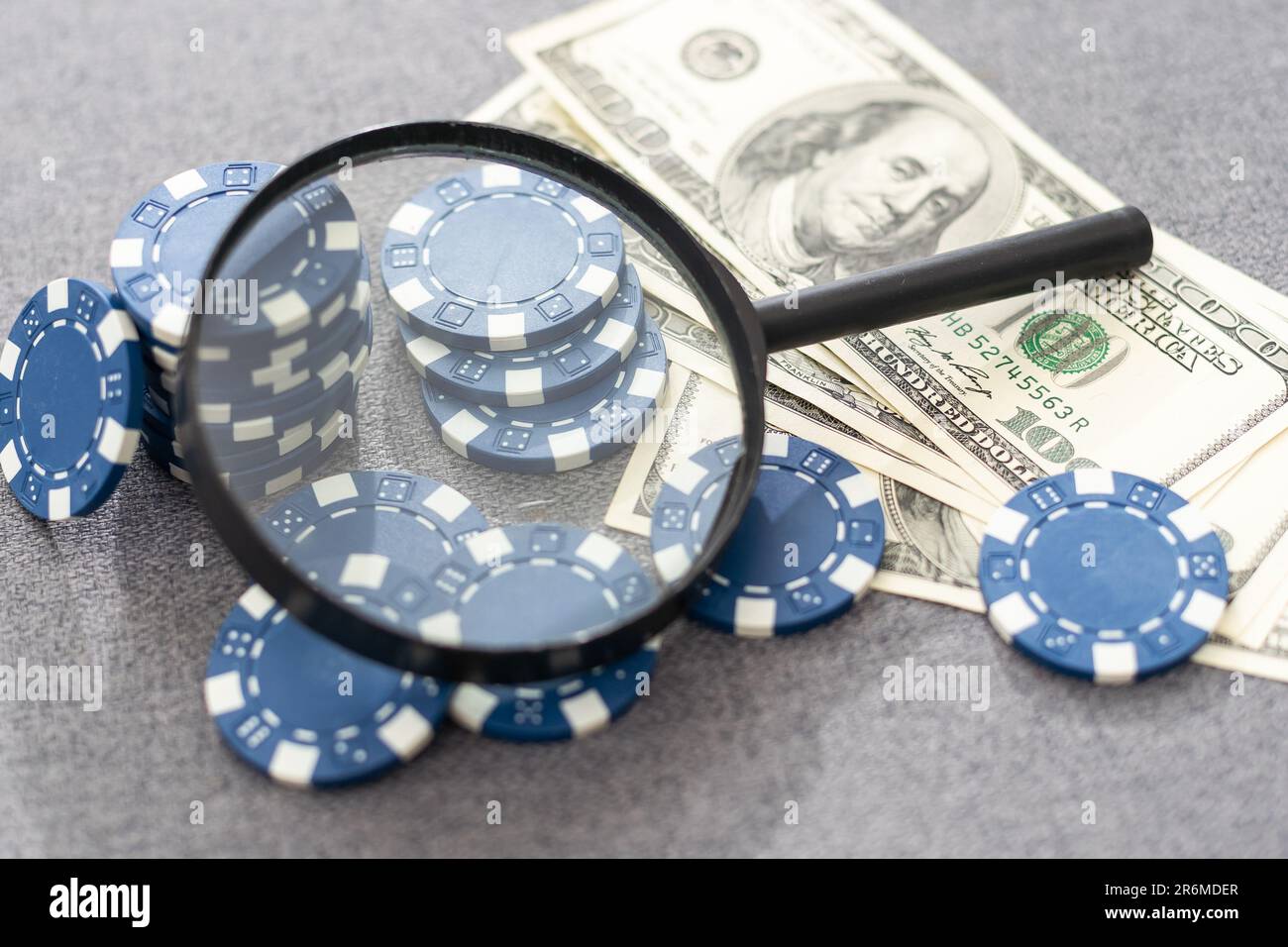 Blue poker chips on stock market chart background Stock Photo - Alamy