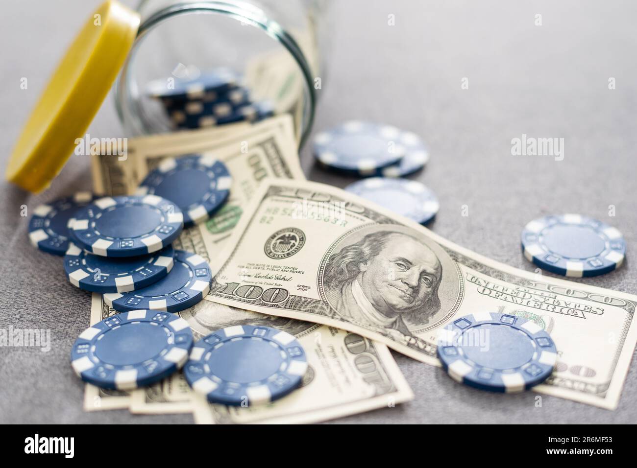 Blue poker chips on stock market chart background Stock Photo - Alamy