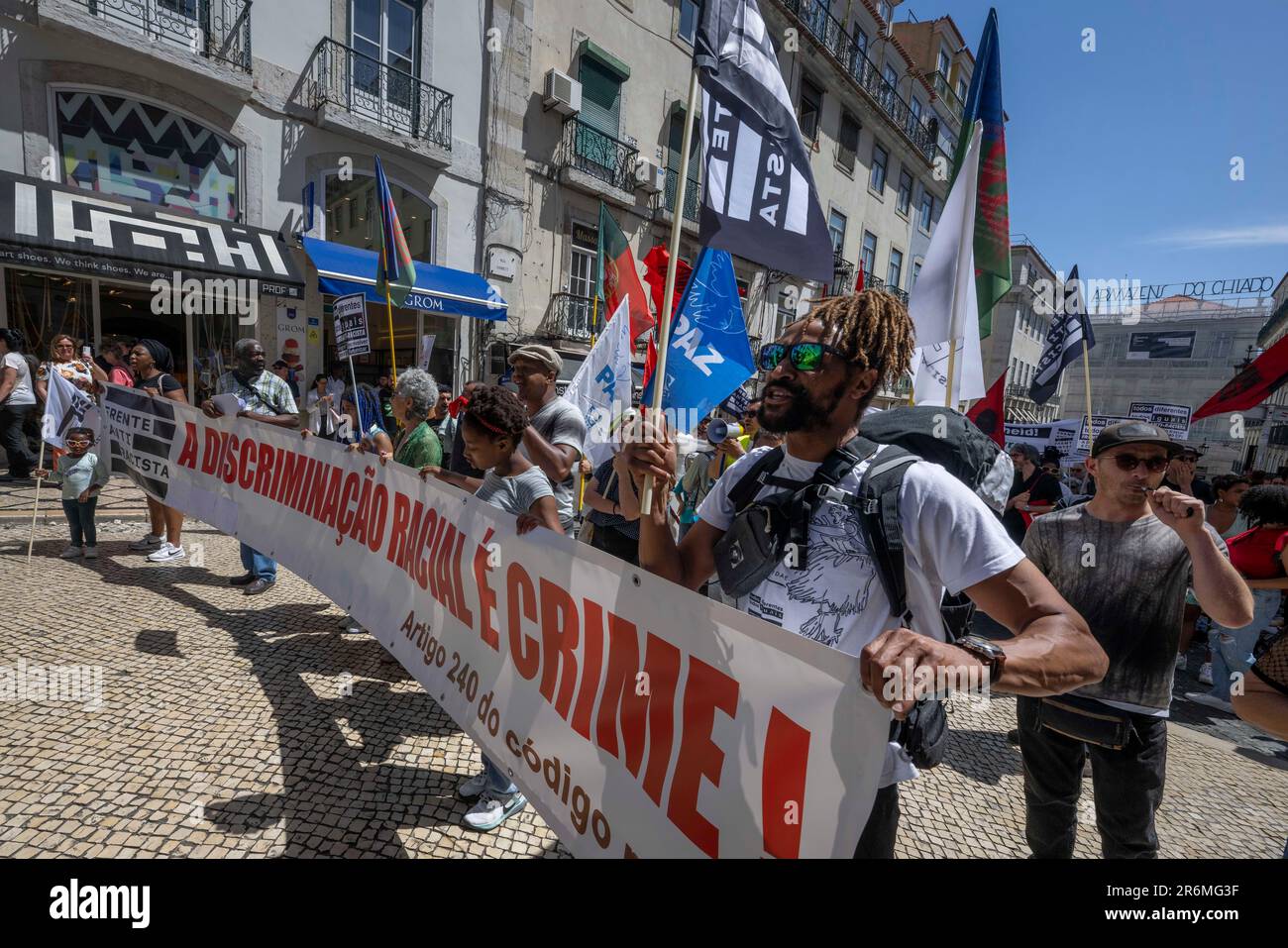 Lisbon, Portugal. 10th June, 2023. Activists hold banners and flags ...