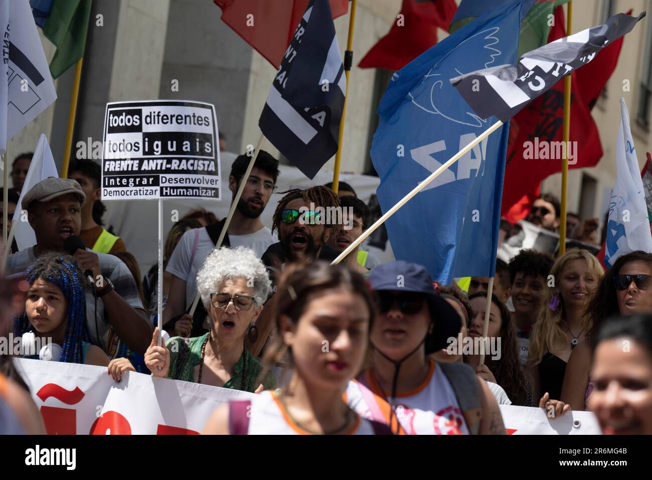 Lisbon, Portugal. 10th June, 2023. Activists hold a banner, flags and ...