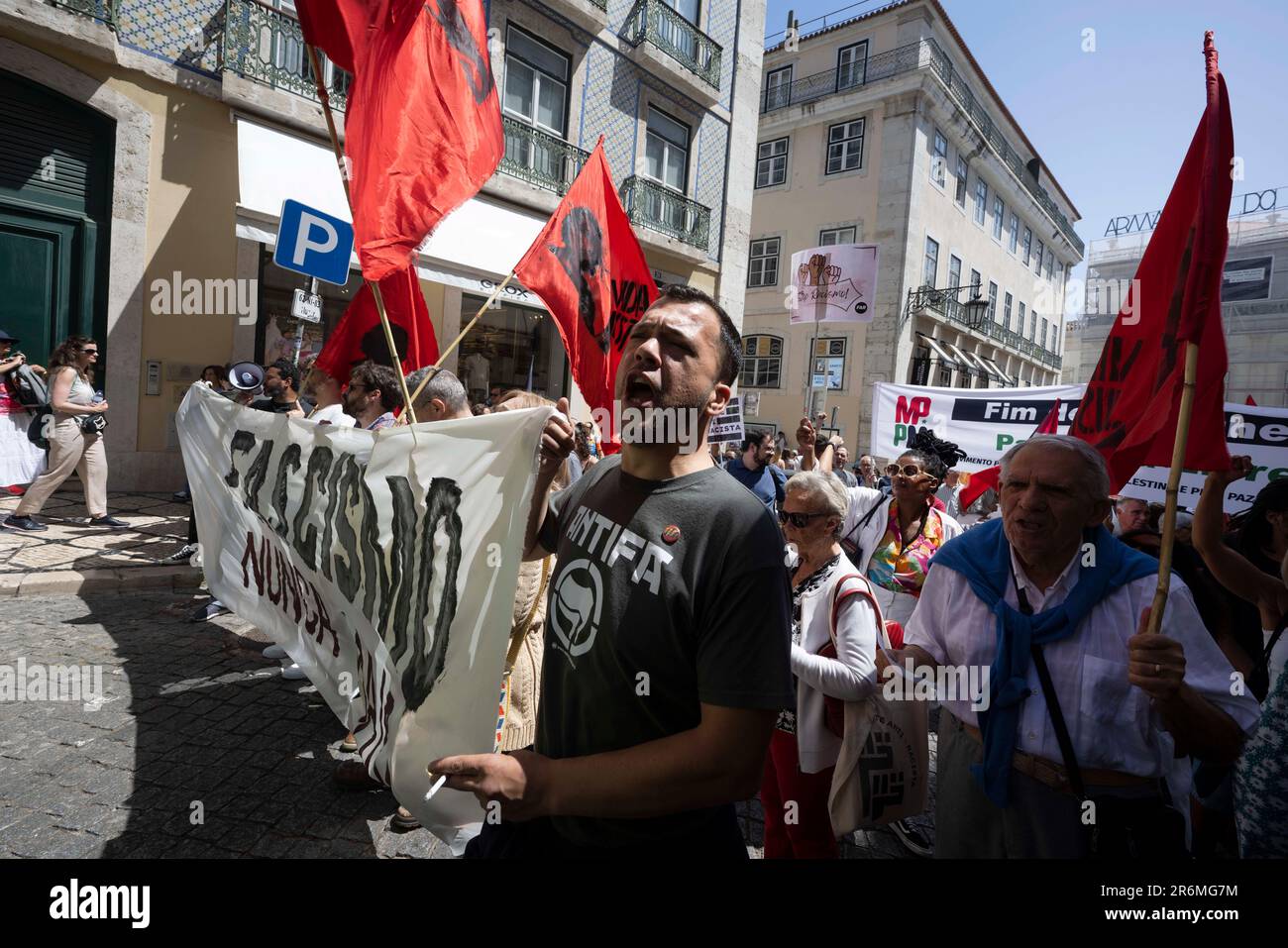 Lisbon, Portugal. 10th June, 2023. Activists hold banners and flags ...