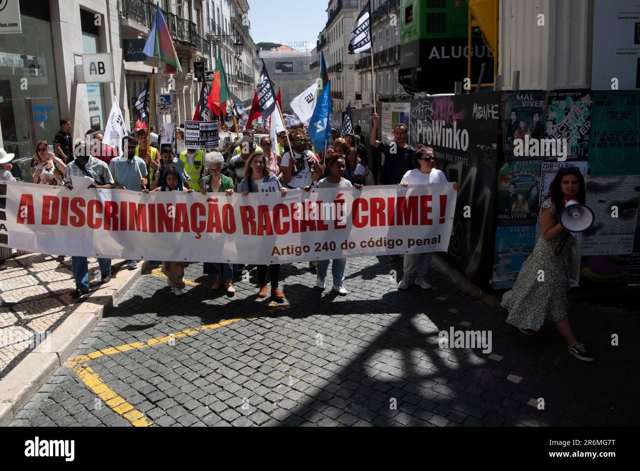 Lisbon, Portugal. 10th June, 2023. Activists hold banners and flags ...