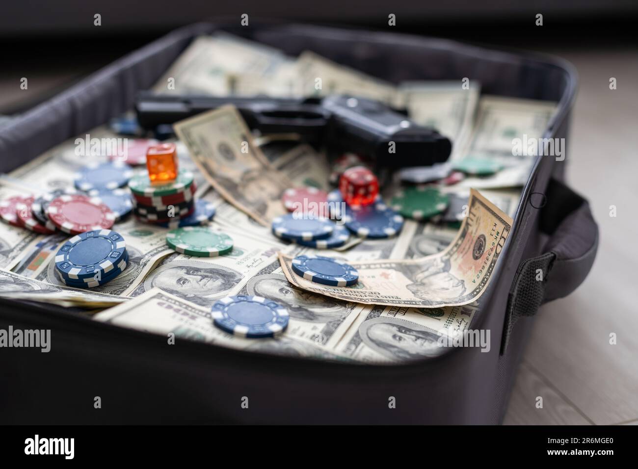 Suitcase with pile of dollars. Opened silver case with money. Better to ...