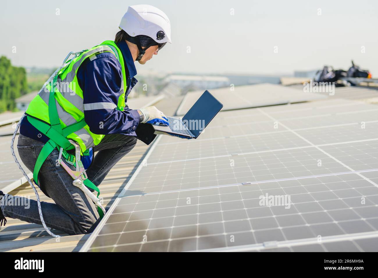 Engineers with safety helmet checking solar system at solar power farm ...