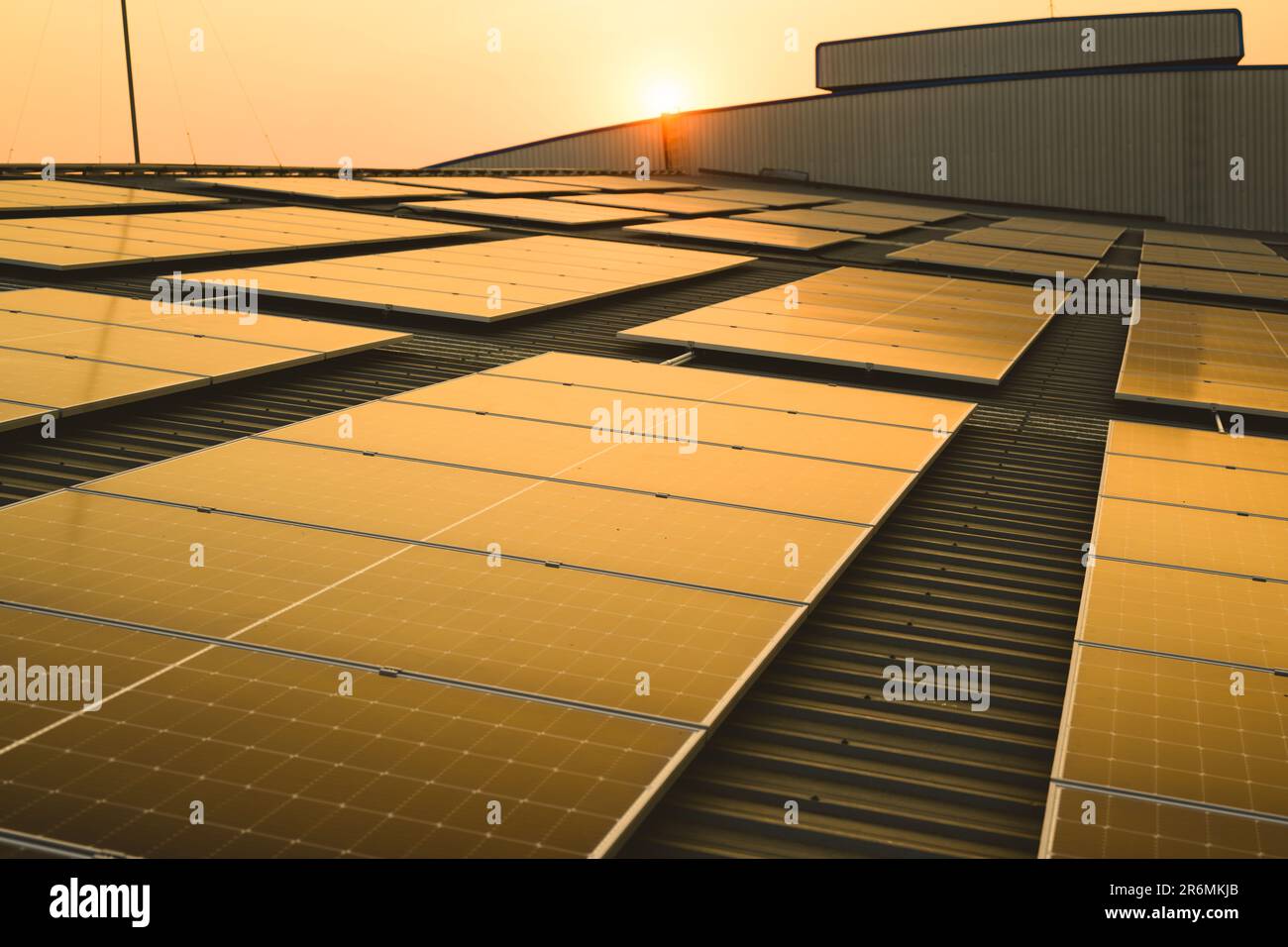 Photovoltaic solar panels on rooftop with sunset at solar cell farm ...