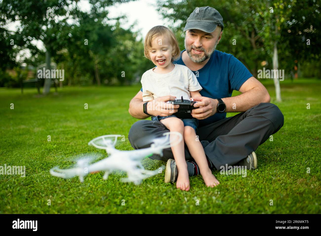 Son father remote controller hi-res stock photography and images - Alamy