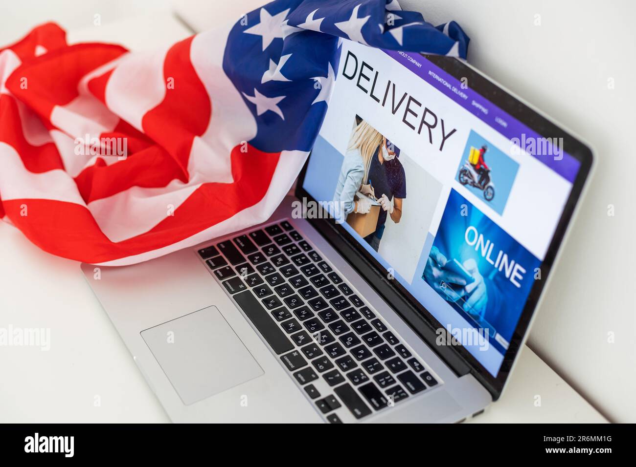 delivery man in red shirt with hygienic mask, holding goods order in ...