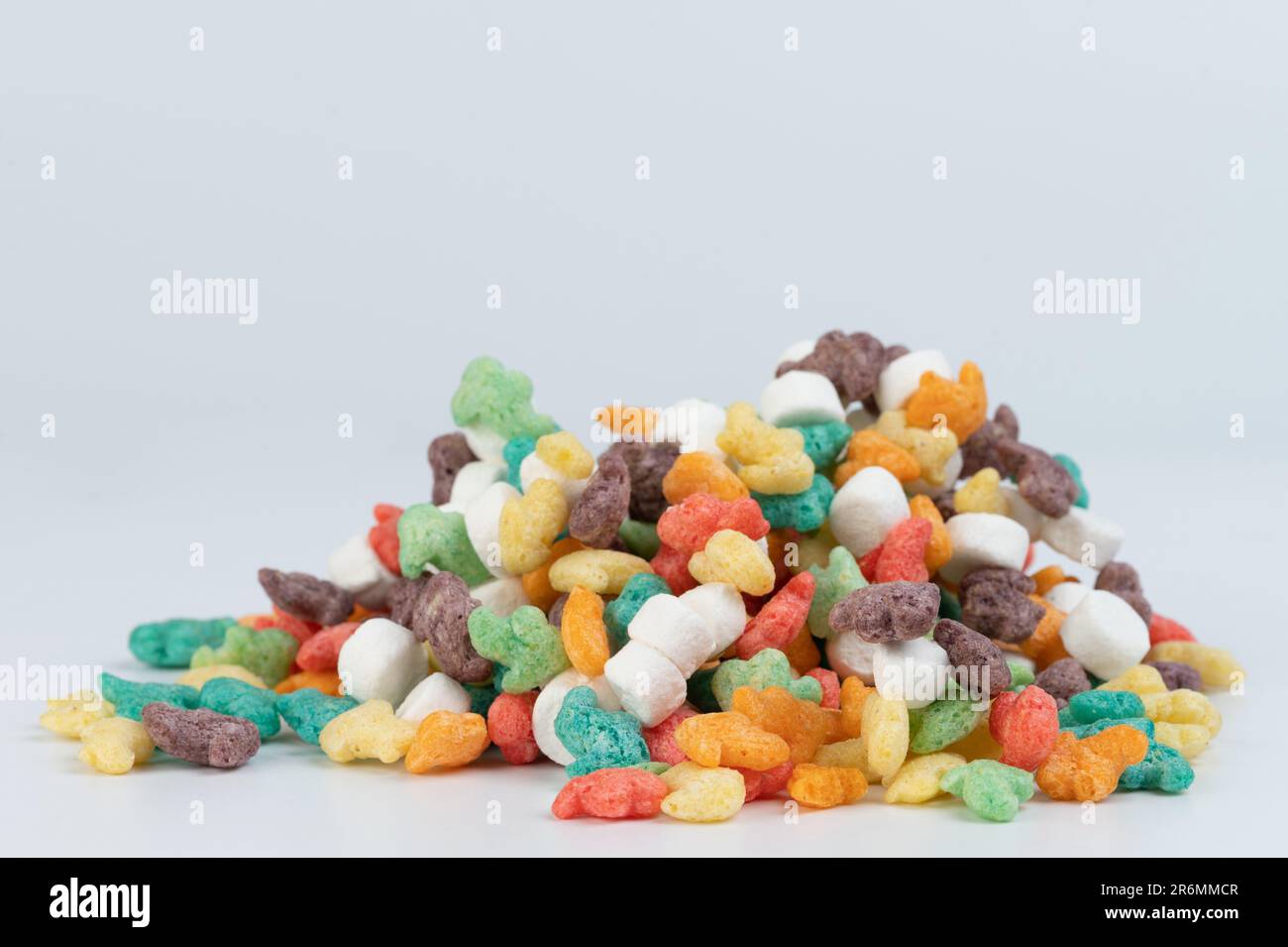 Pile of sweet cornflakes isolated on white studio background Stock ...
