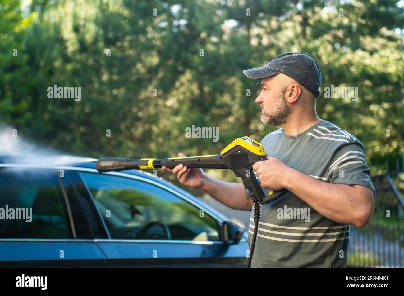 Man washing car using jet spray hi-res stock photography and images - Alamy