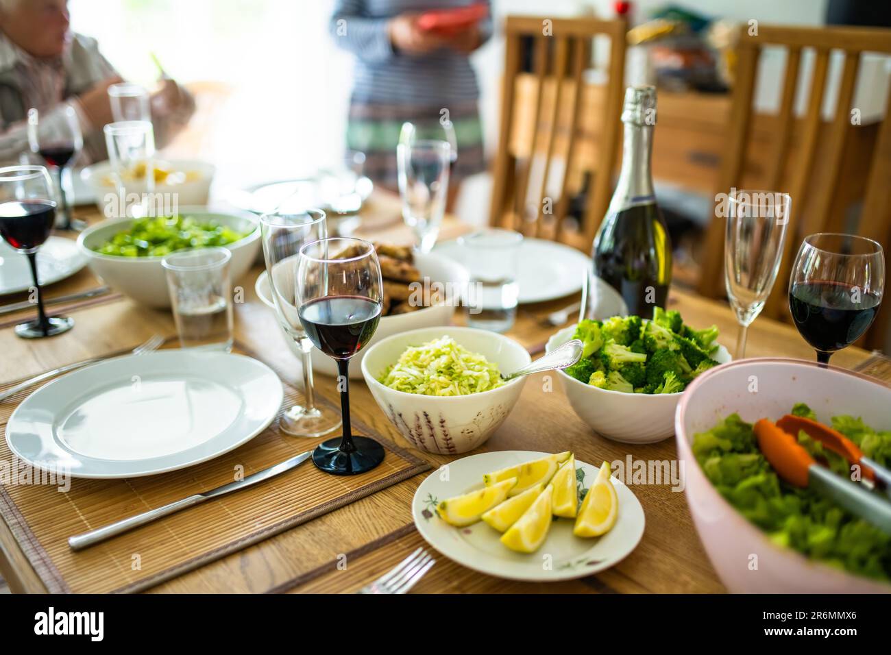 Simple family dinner with wine at home. Eating at home with a family ...