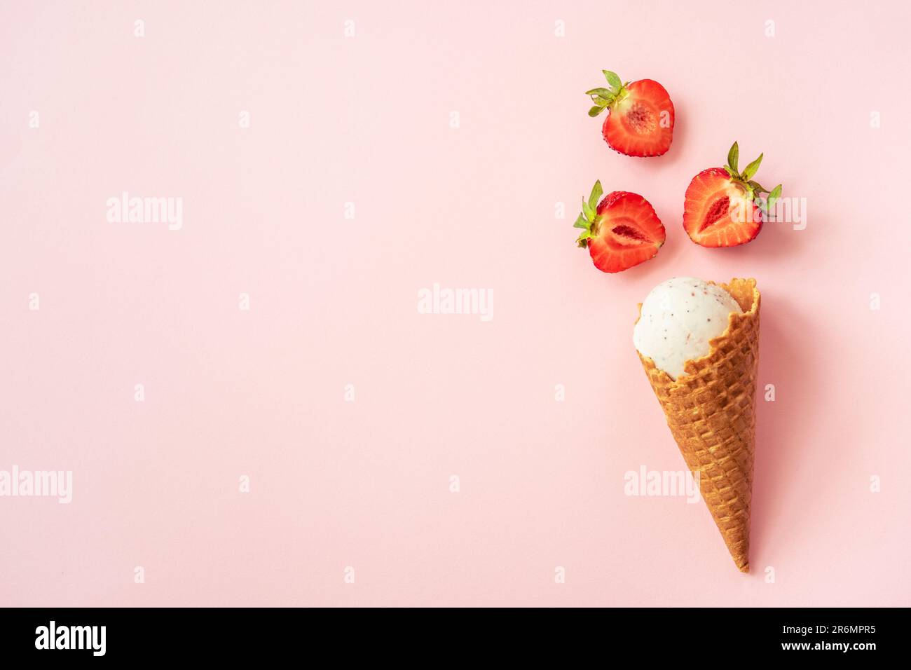 Strawberry ice cream cone top view on pink Stock Photo - Alamy