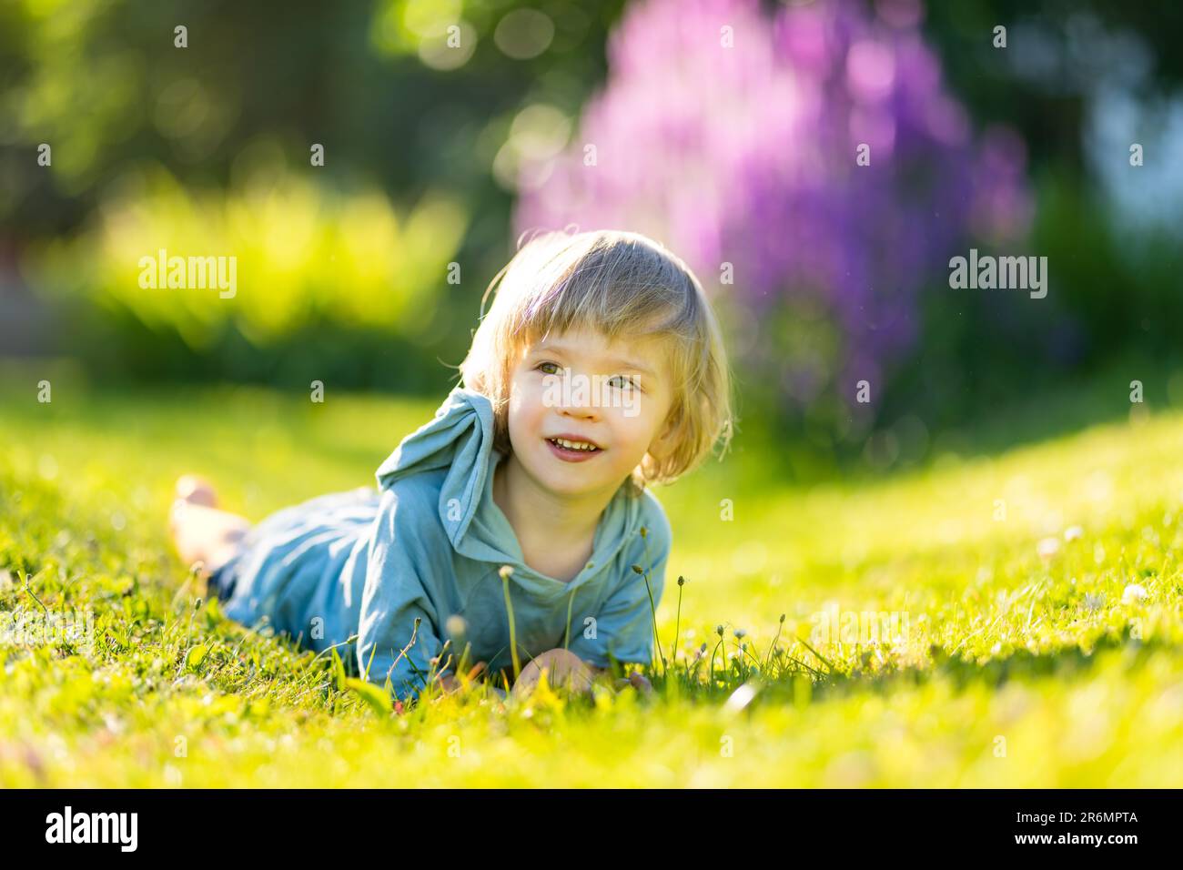 Adorable toddler boy having fun outdoors on sunny summer day. Child ...