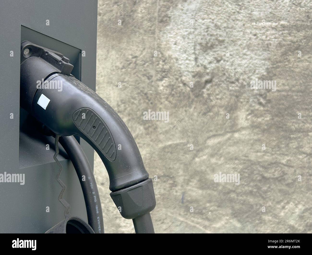 Gun charging for electric vehicles Stock Photo - Alamy
