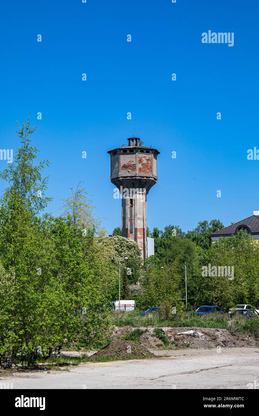 Derelict Becker water tower, built in 1913, against clear blue sky in ...