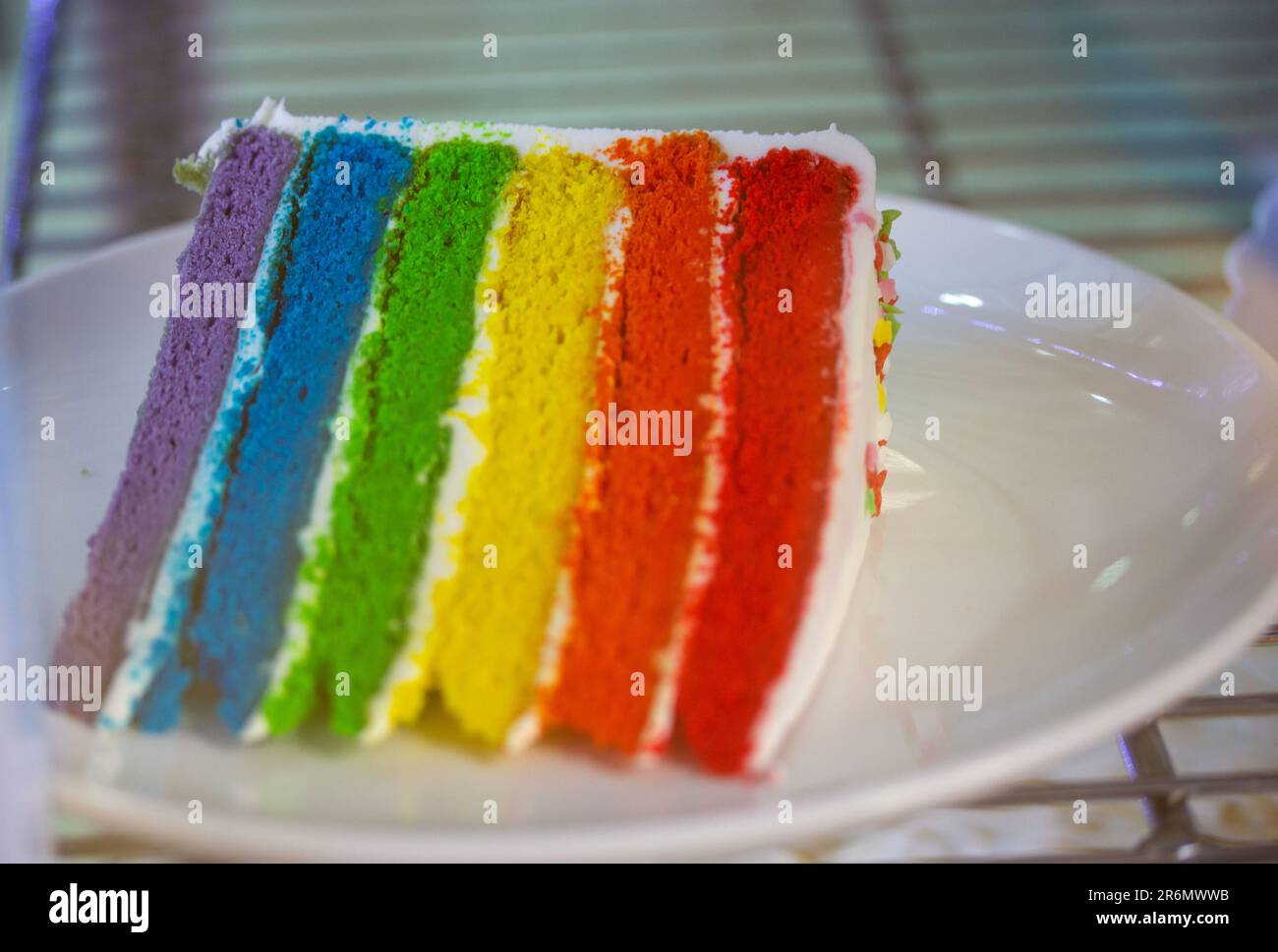 Rainbow cake with colored filling, layered cakes. Baked layer sweet ...
