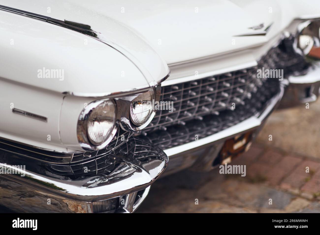 Izmir, Turkey - June 3, 2023: Close-up of the headlight of a white 1960 ...