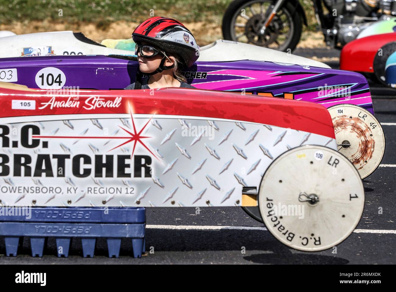 Stock driver Carsyn Locher patiently waits with her soap box derby car ...