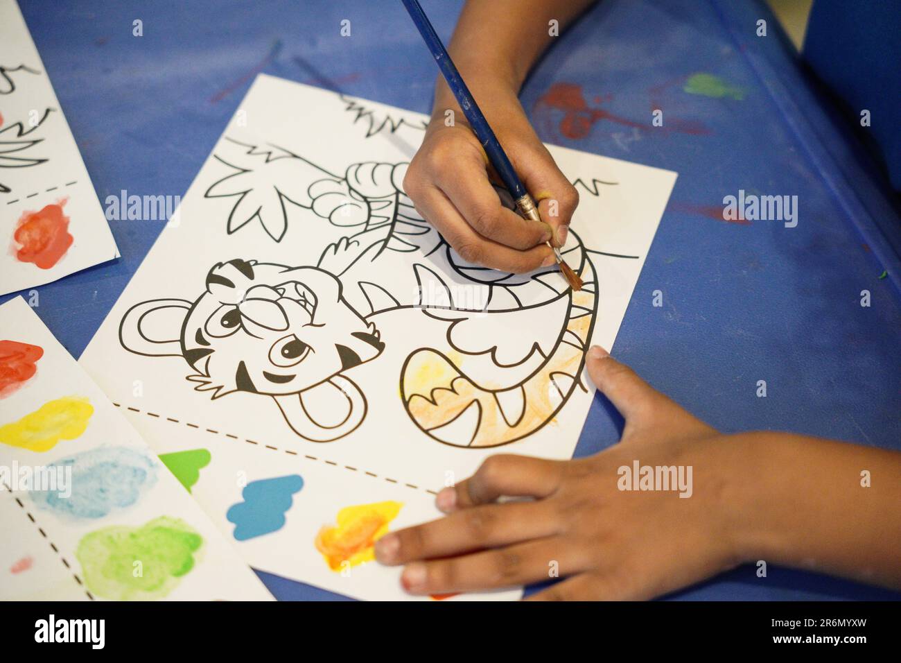 Kids coloring lion animal at school Stock Photo - Alamy